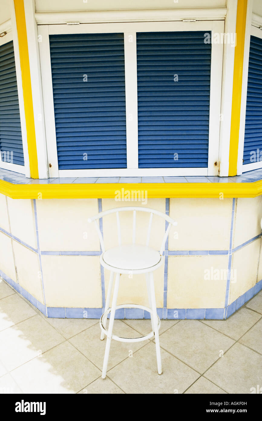 Chair in front of a closed store Stock Photo - Alamy