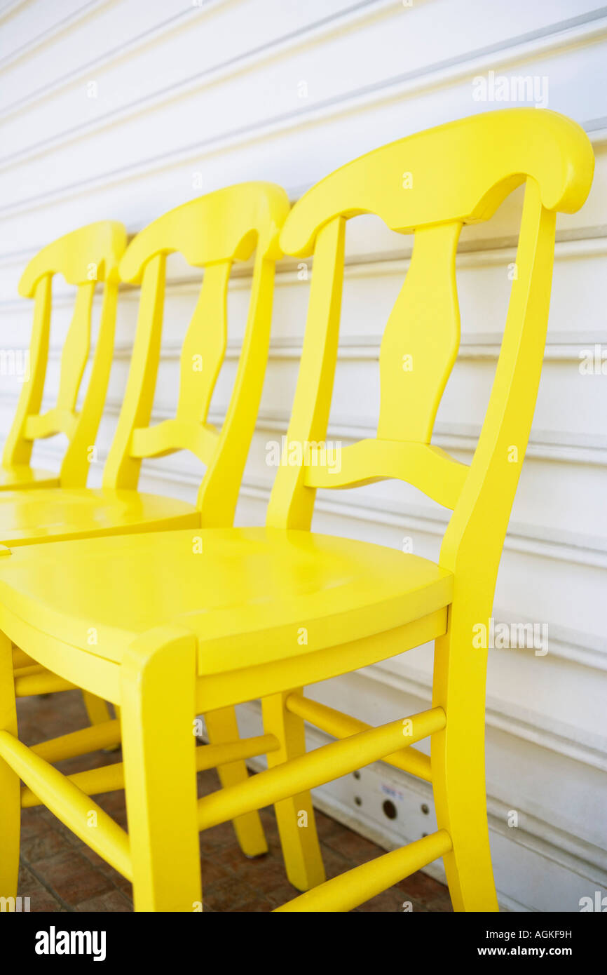 Close-up of three empty chairs in a row Stock Photo - Alamy