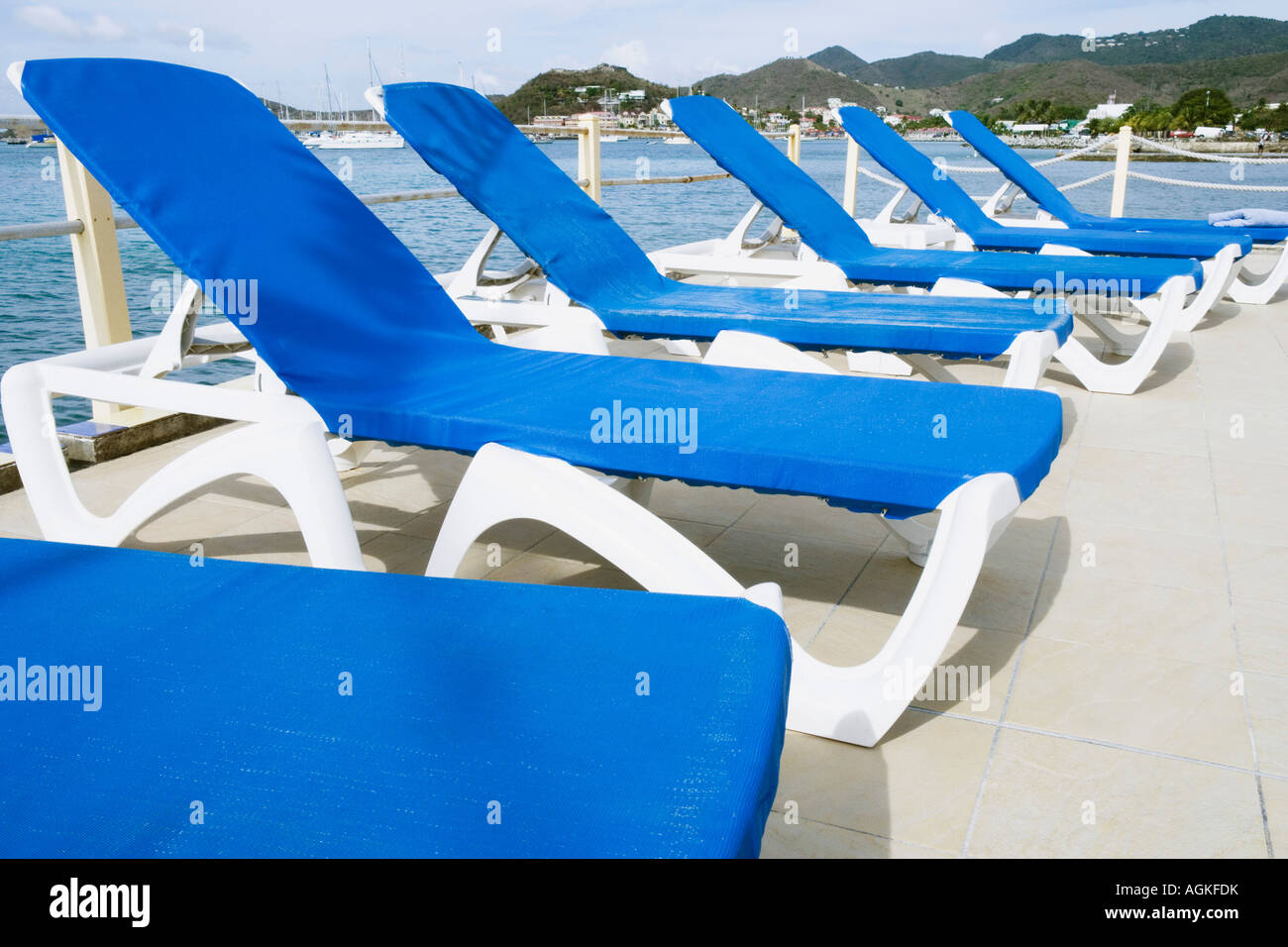 Lounge chairs in a row Stock Photo - Alamy