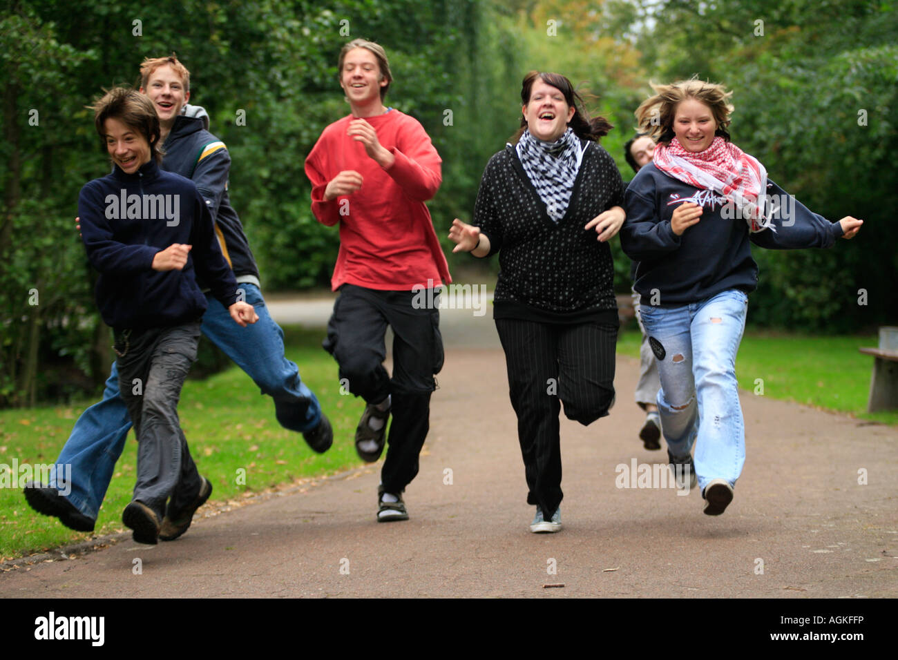 a group of teenagers having a race Stock Photo - Alamy