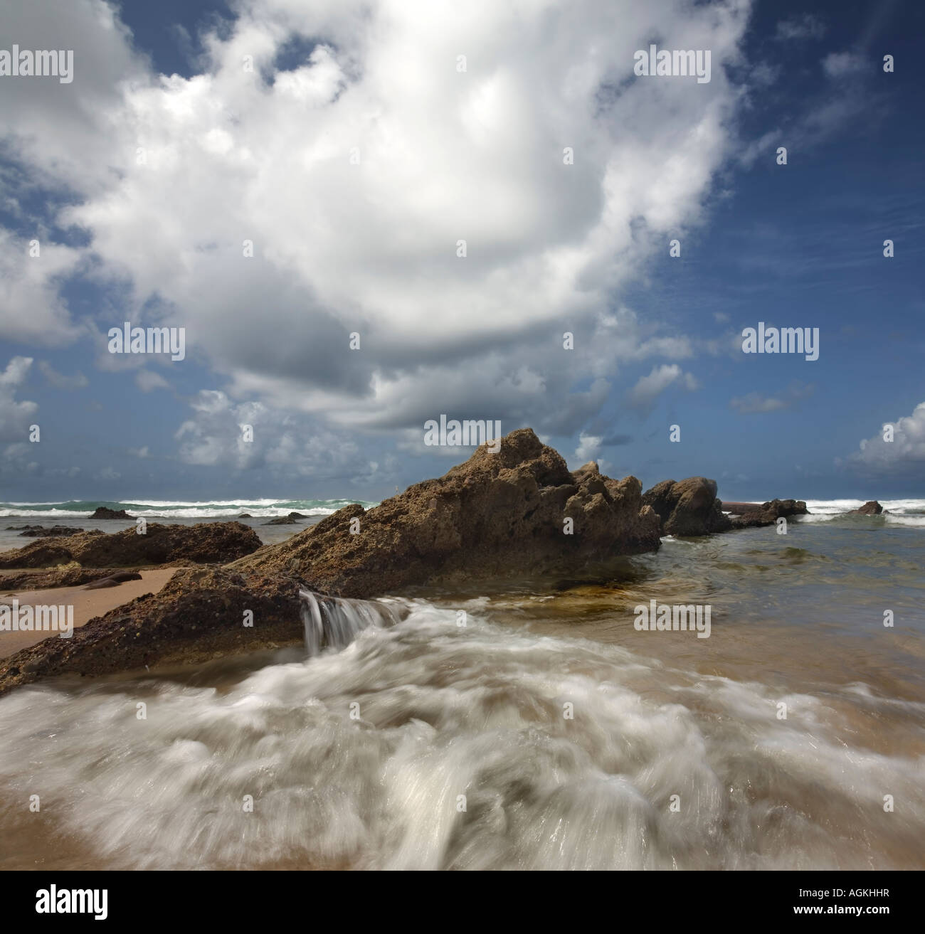 Splashing wave on rocks, Bathsheba, Barbados Stock Photo - Alamy