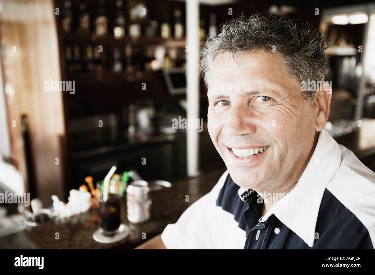 Portrait of a senior man smiling Stock Photo - Alamy