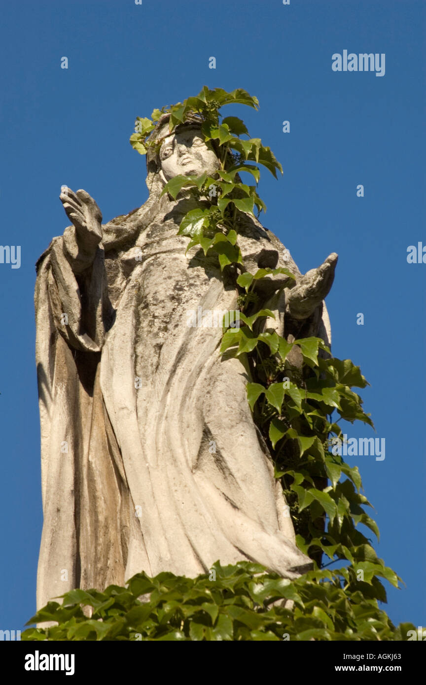 Overgrown statue of nun Entrance to Poor Clares Convent Cracow Poland ...