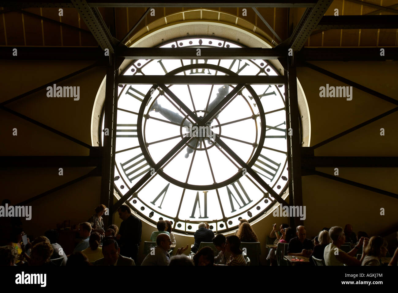 Europe, France, Paris. Diners behind one of the famous clocks in the ...