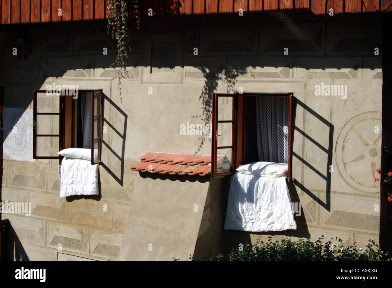 Bedding is aired at a window. Photo by Willy Matheisl Stock Photo - Alamy