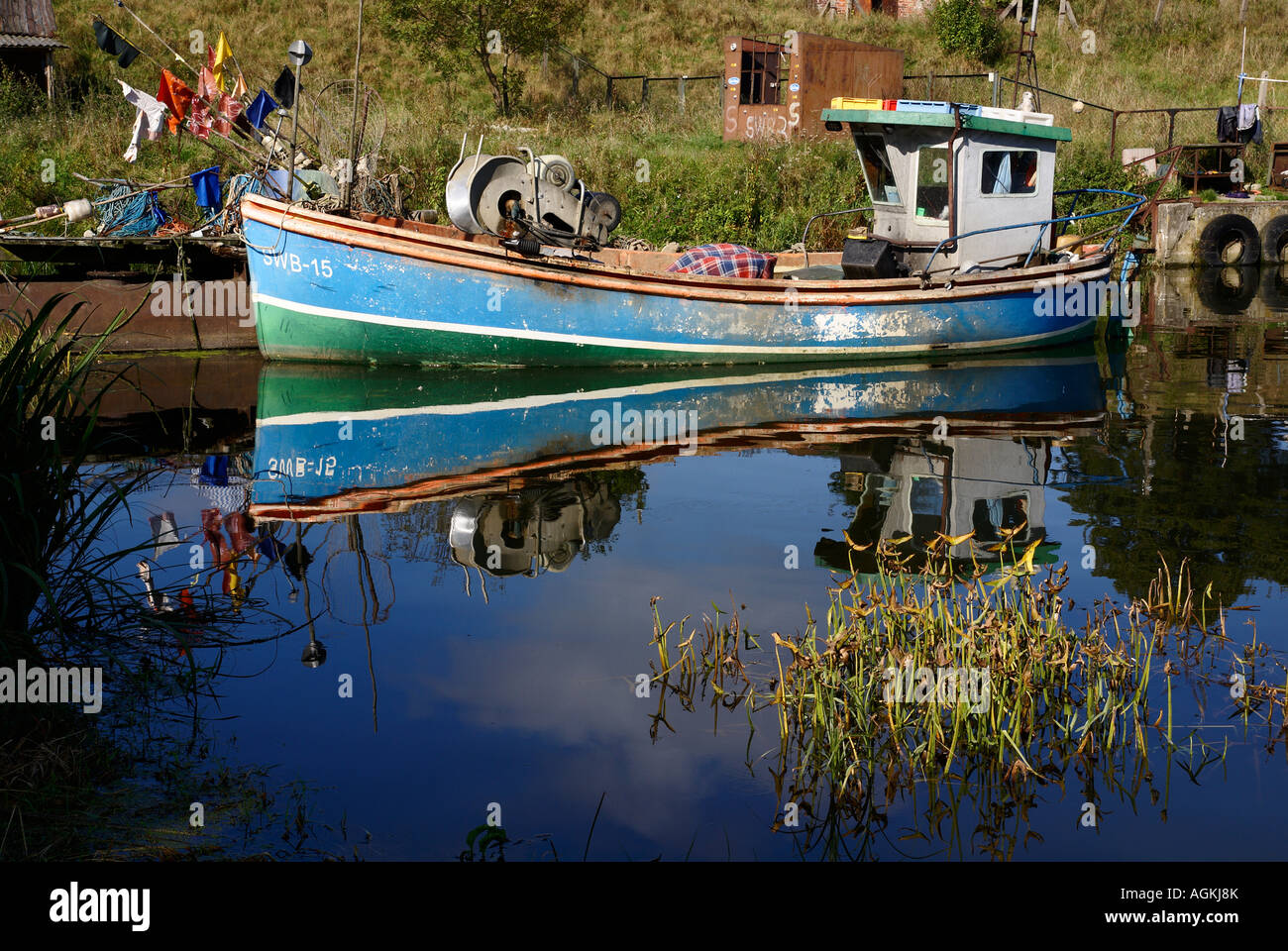 a picture of a small fishing boat in Poland Stock Photo - Alamy