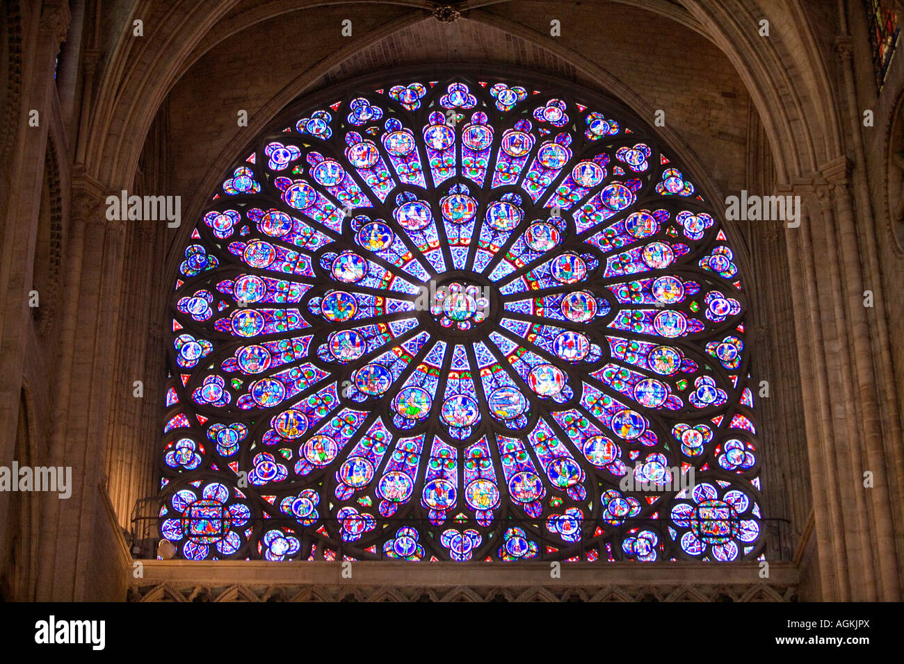 France, Paris. Interior detail of stained glass window in Notre Dame ...