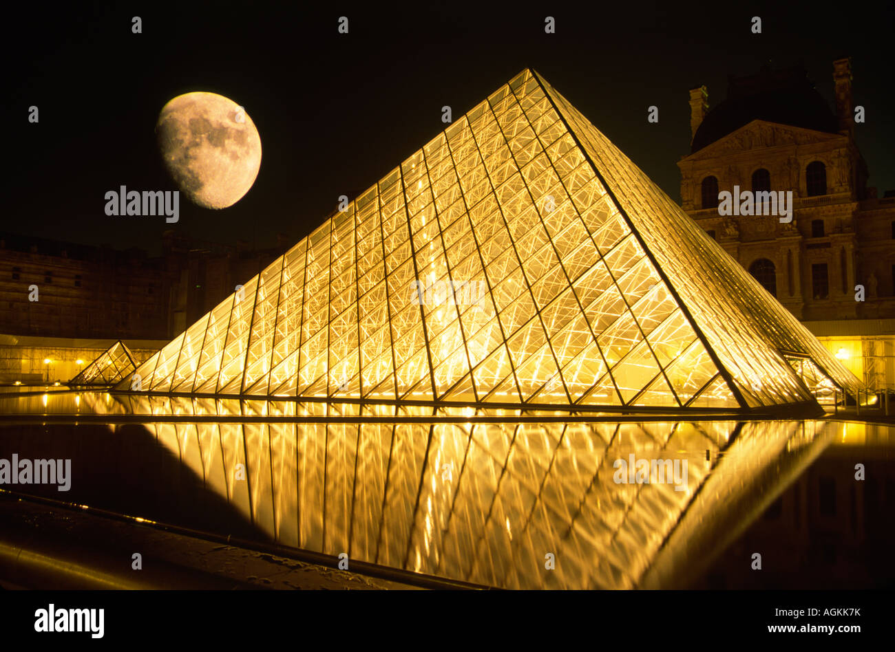 France, Paris, The Louvre Museum, Nighttime composite of moon and ...