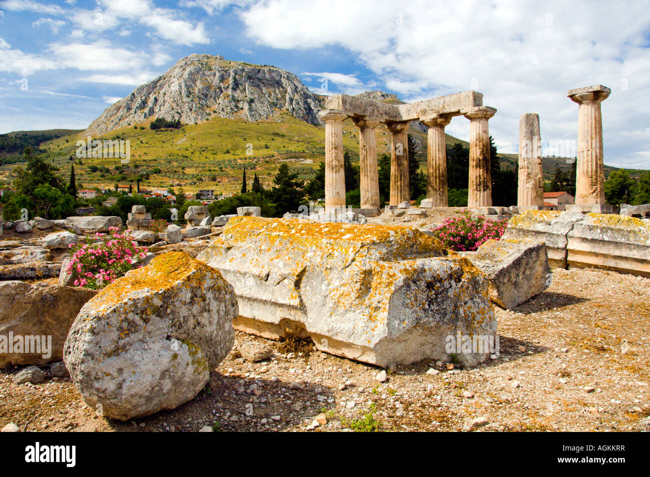 Ruins of the ancient city of Corinth with the Acropolis of Acrocorinth ...