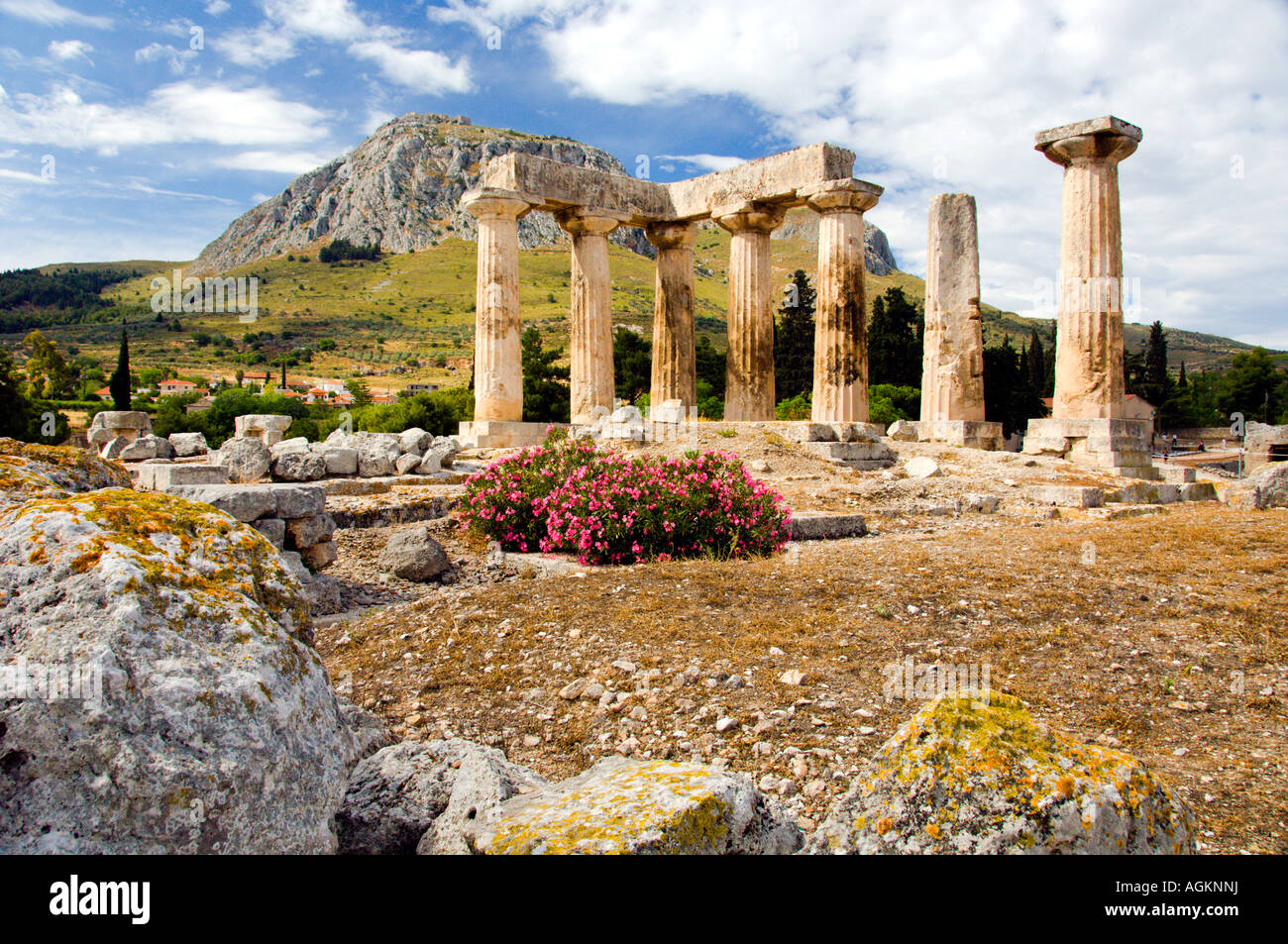 Ruins of the ancient city of Corinth with the Acropolis of Acrocorinth ...
