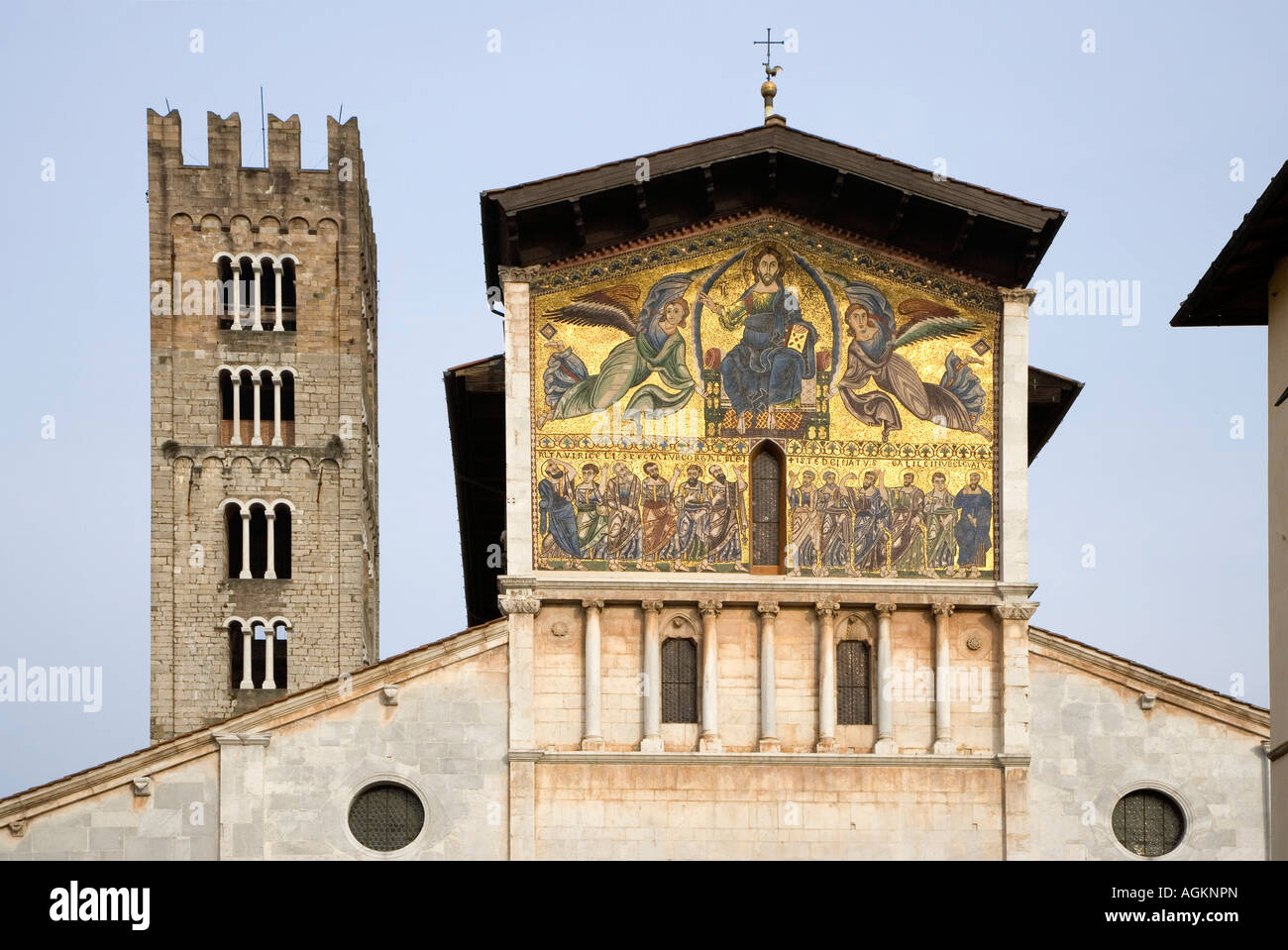 Europe, Italy, Lucca. View of outside religious artwork on top wall of ...