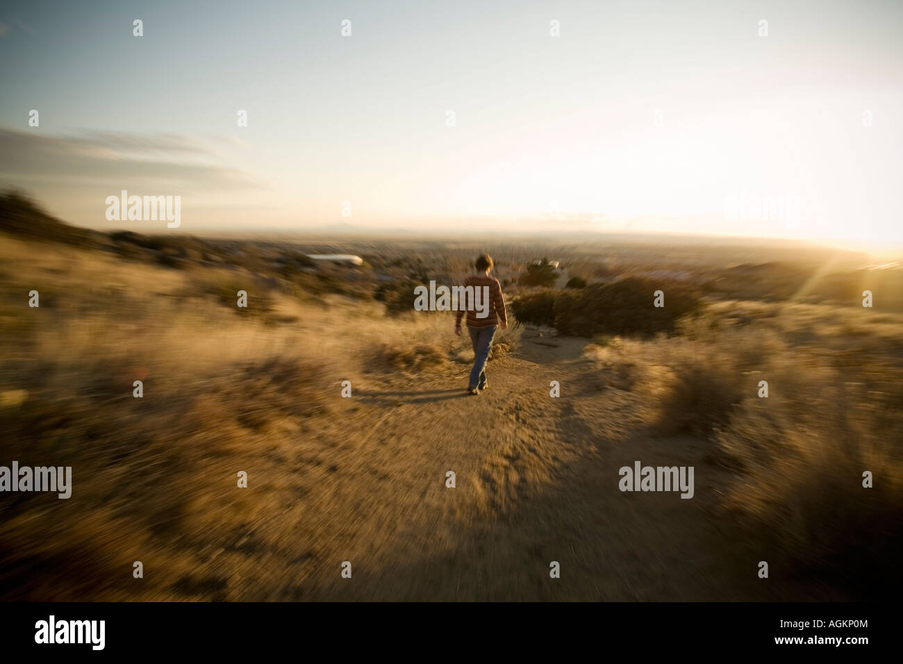 Person walking down a path Stock Photo - Alamy