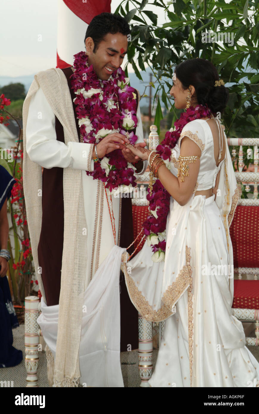 A couple exchanging rings during ring ceremony Stock Photo - Alamy