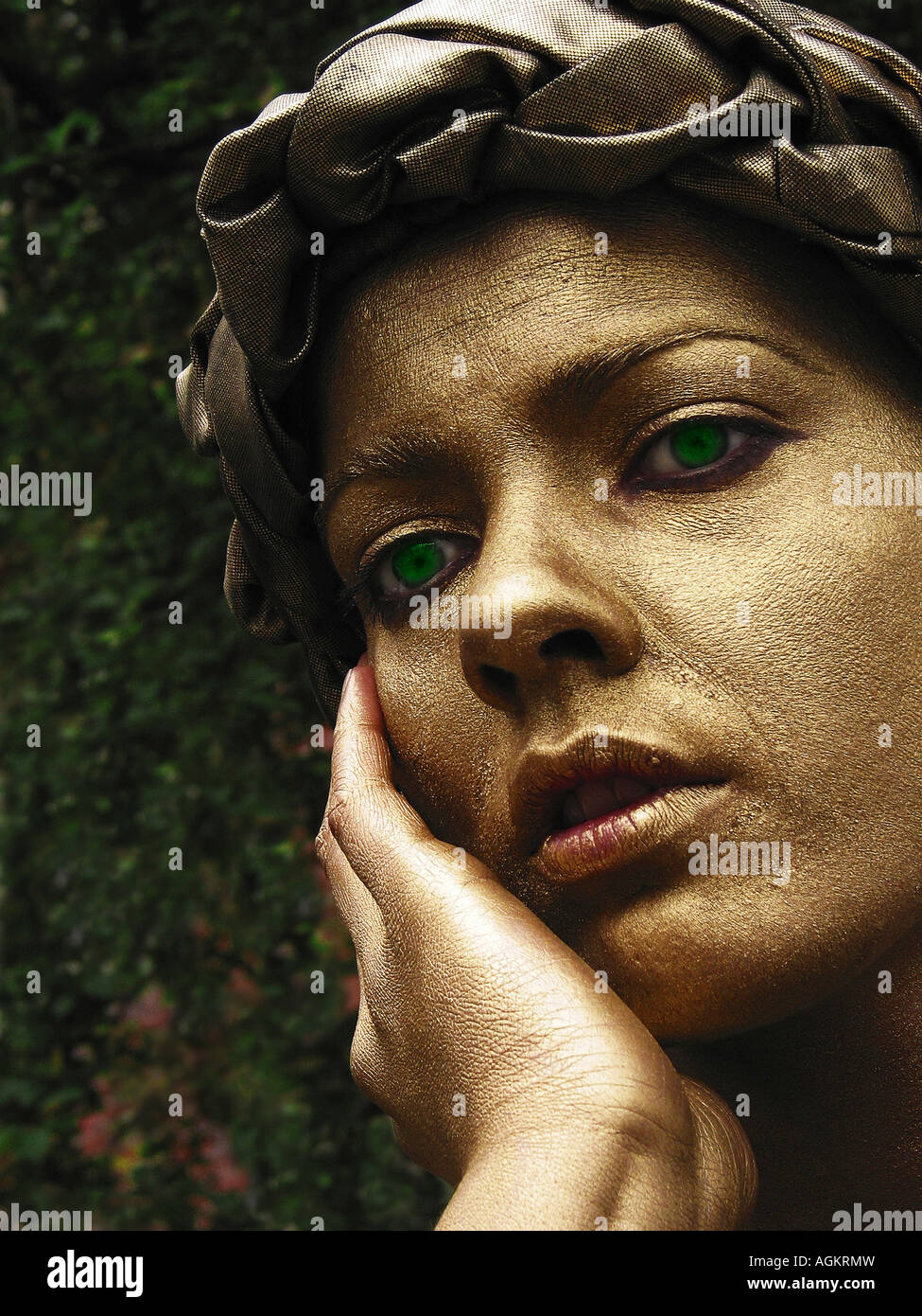 England, London. Gold-painted face of female mime street performer at ...