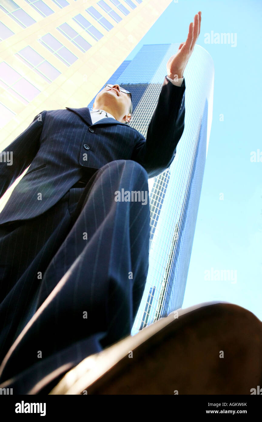 Businessman Walking from Low Angle Stock Photo - Alamy