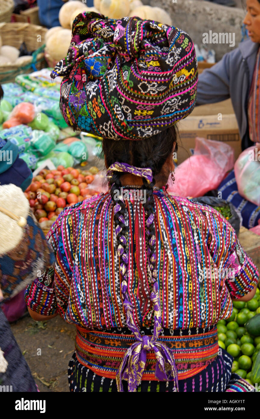 Guatemala, Solola, Back of woman in colorful Mayan clothes and ...