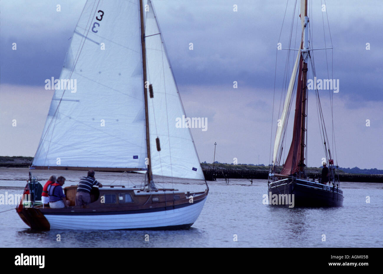 Traditional yachts pass one another Walton Backwaters near Walton on ...