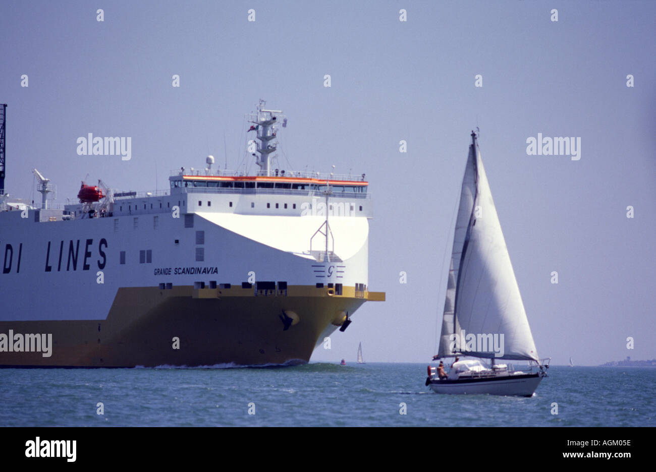 Yacht at risk of collision with ship Stock Photo - Alamy