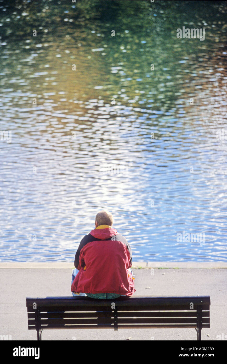 People sitting bench in front lake park bench hi-res stock photography ...