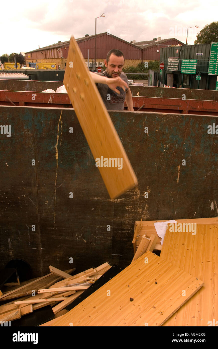 Man disposing of timber waste at Space Waye Recycling and Reuse Centre ...