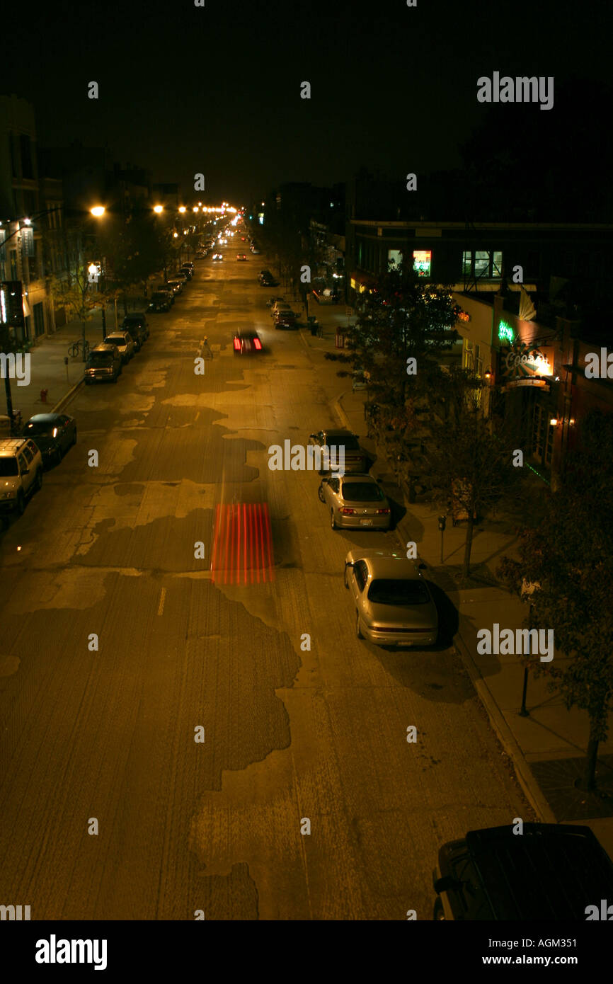 a car driving down an empty street late at night Stock Photo - Alamy
