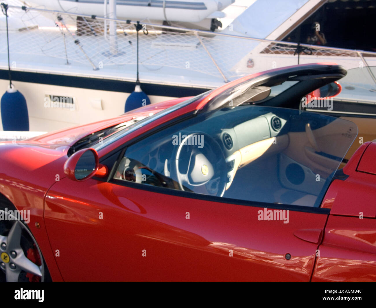 Red Ferrari sports car and boats Puerto Banus Costa del Sol Spain ...