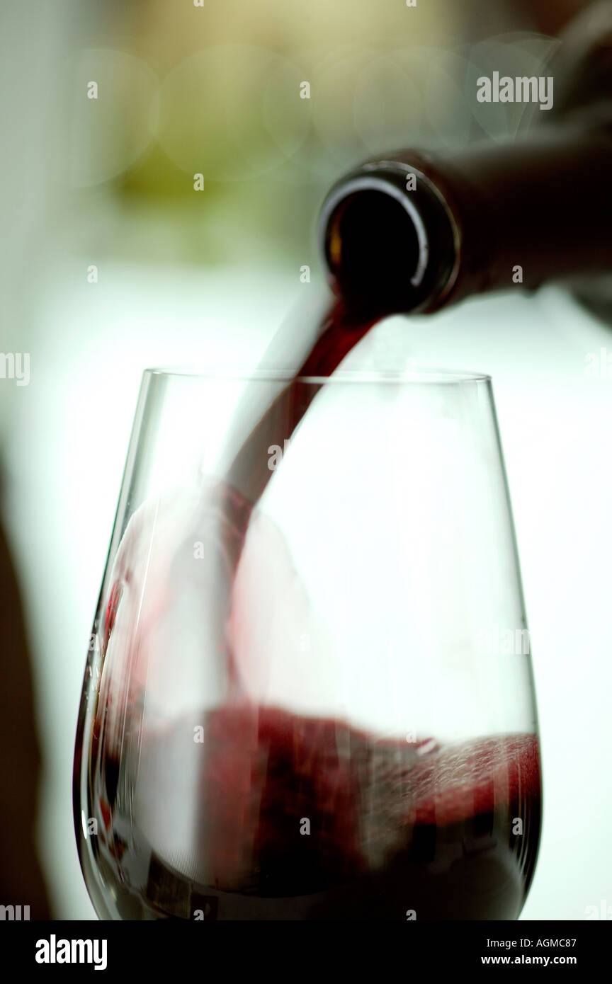 red wine being poured Stock Photo - Alamy