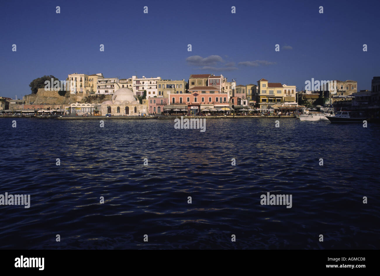 Eastern side of Chania harbour basking in evening sun, Crete, Greece ...
