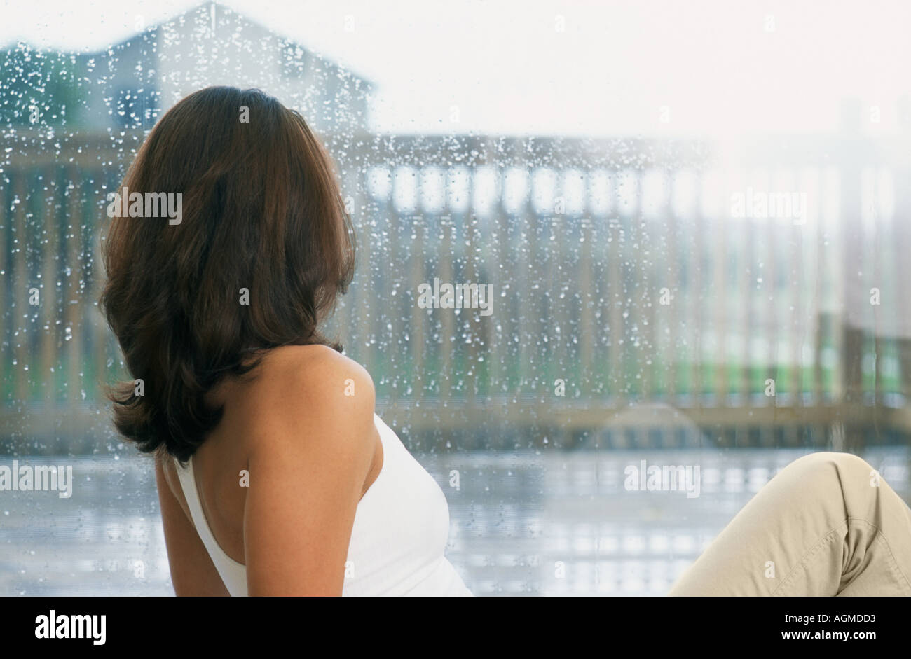 Woman out of window raining hi-res stock photography and images - Alamy