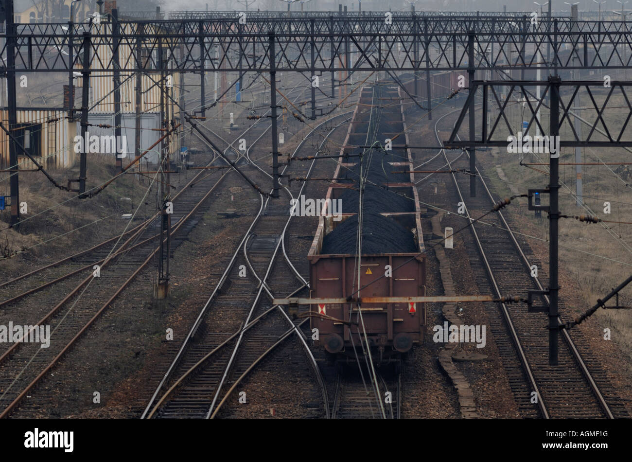 A coal freight train passes through the railway junction at Oswiecim in ...