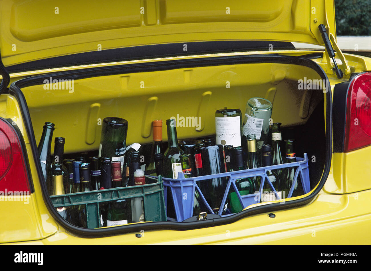 Crates of Glass Bottles in Car Boot for Recycling Stock Photo - Alamy