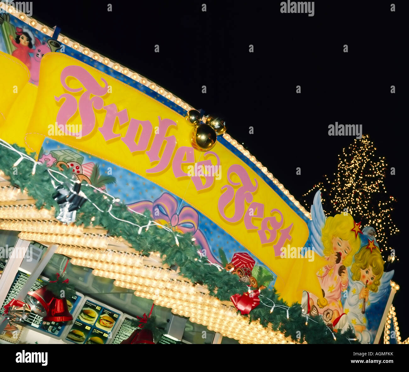 illuminated booth with greetings for merry fest on the Christmas fair ...