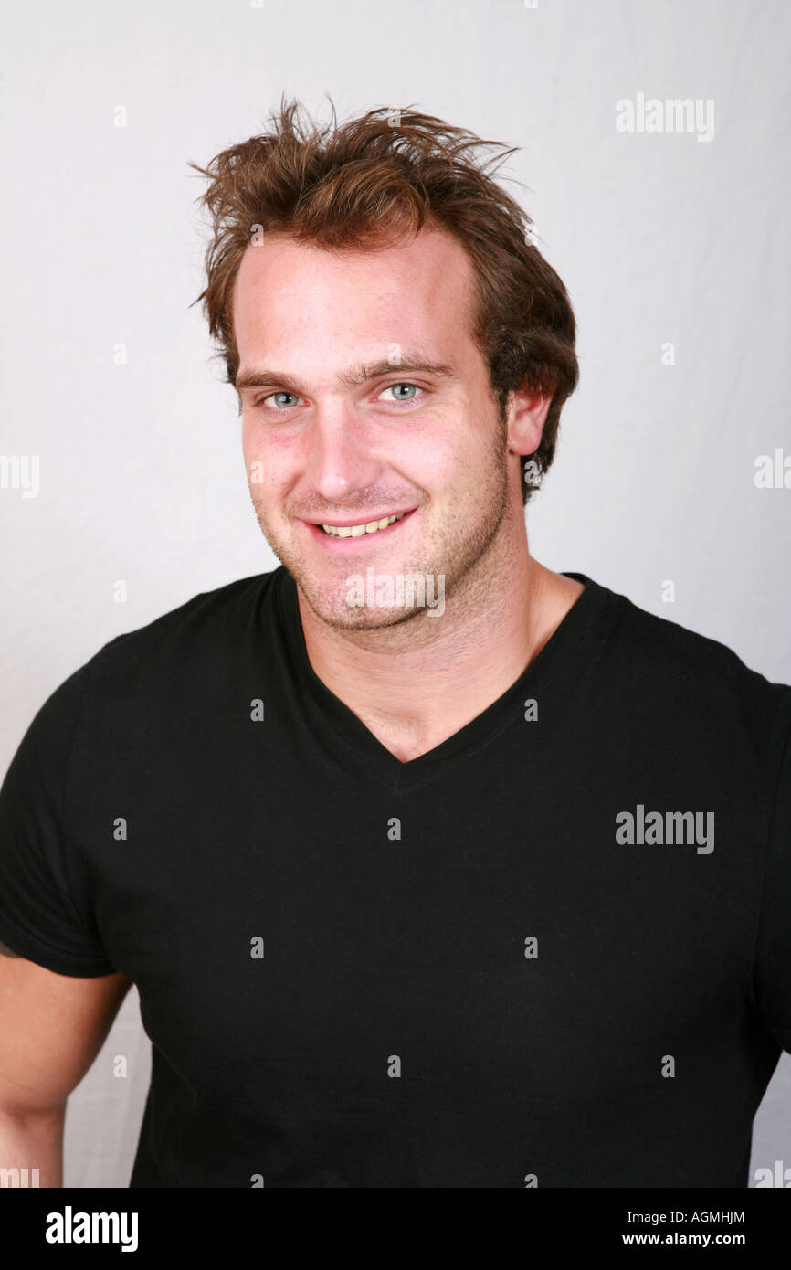 Handsome attractive young 20's male man in black top smiling with a few ...