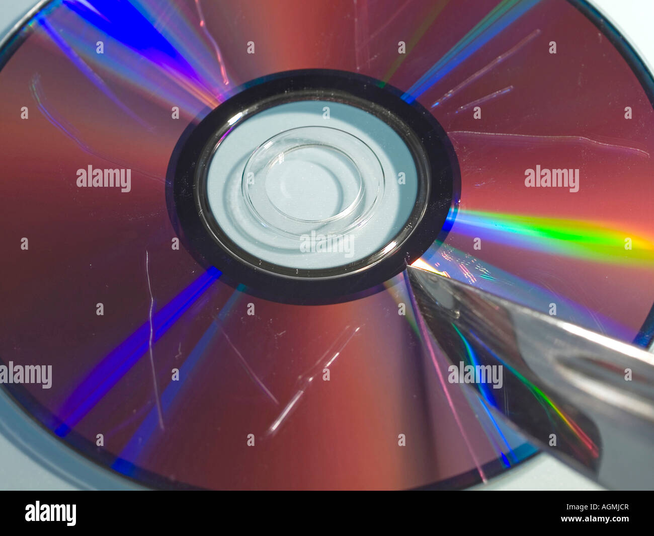 destroying marking CD DVD data medium storage with a knife Stock Photo ...