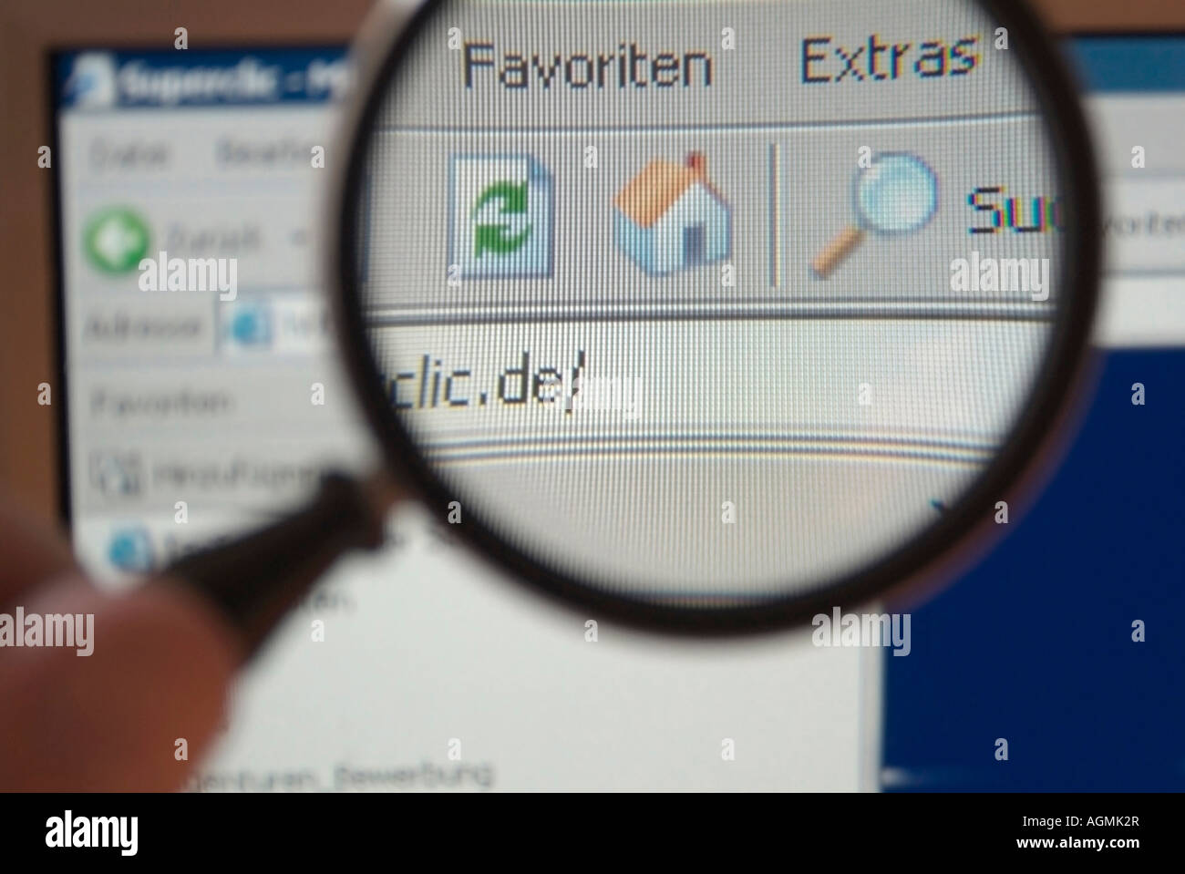 looking through magnifying glass on screent of a PC with browser for ...