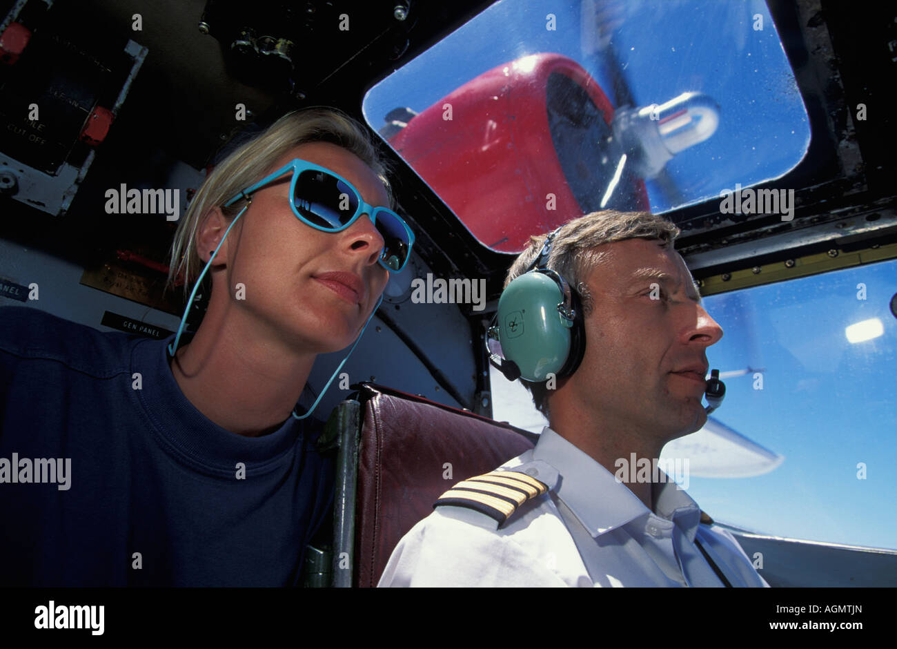 Brazil, Salvador, Woman and pilot traveling in Catalina hydroplane ...