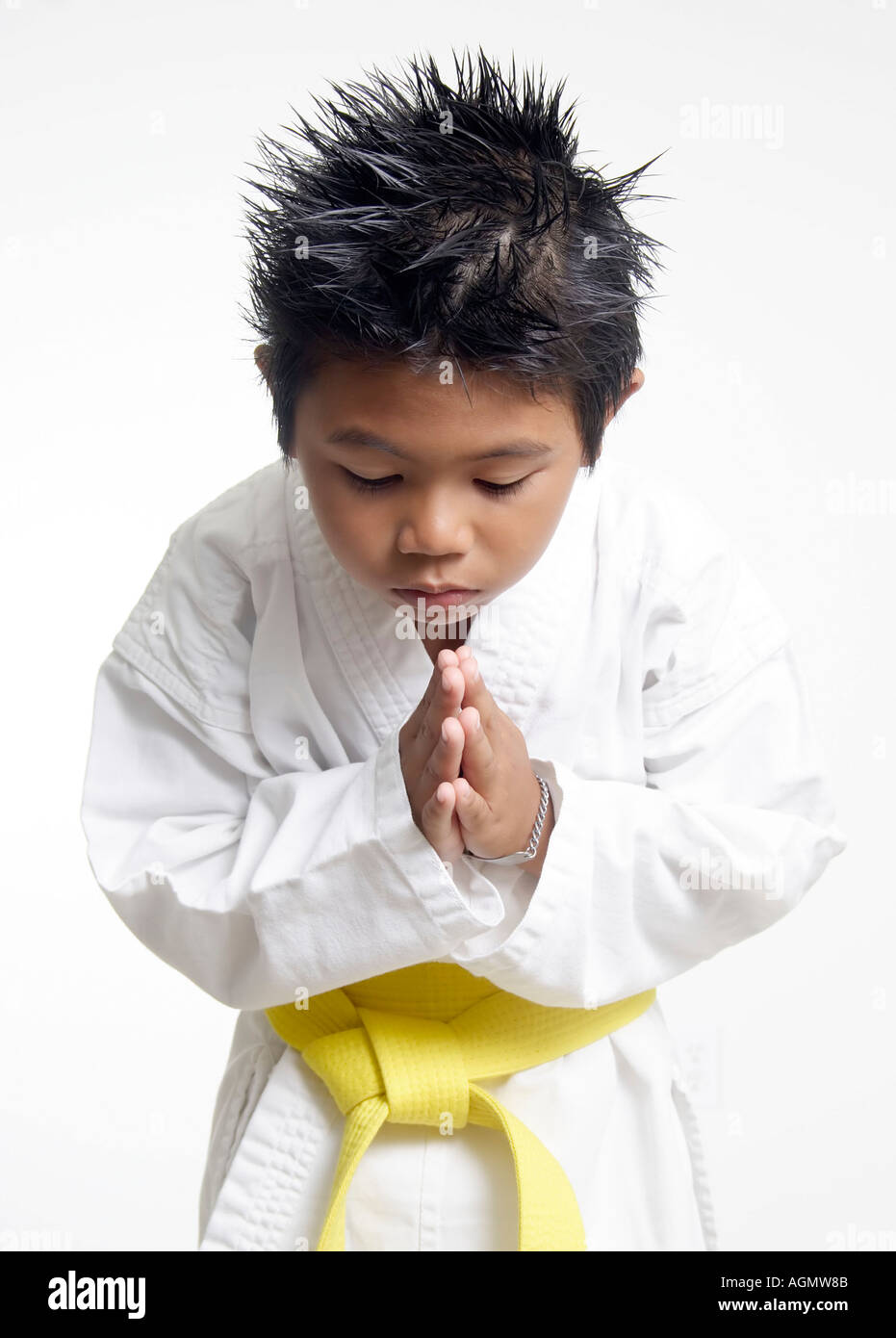 Karate boy bowing Stock Photo - Alamy