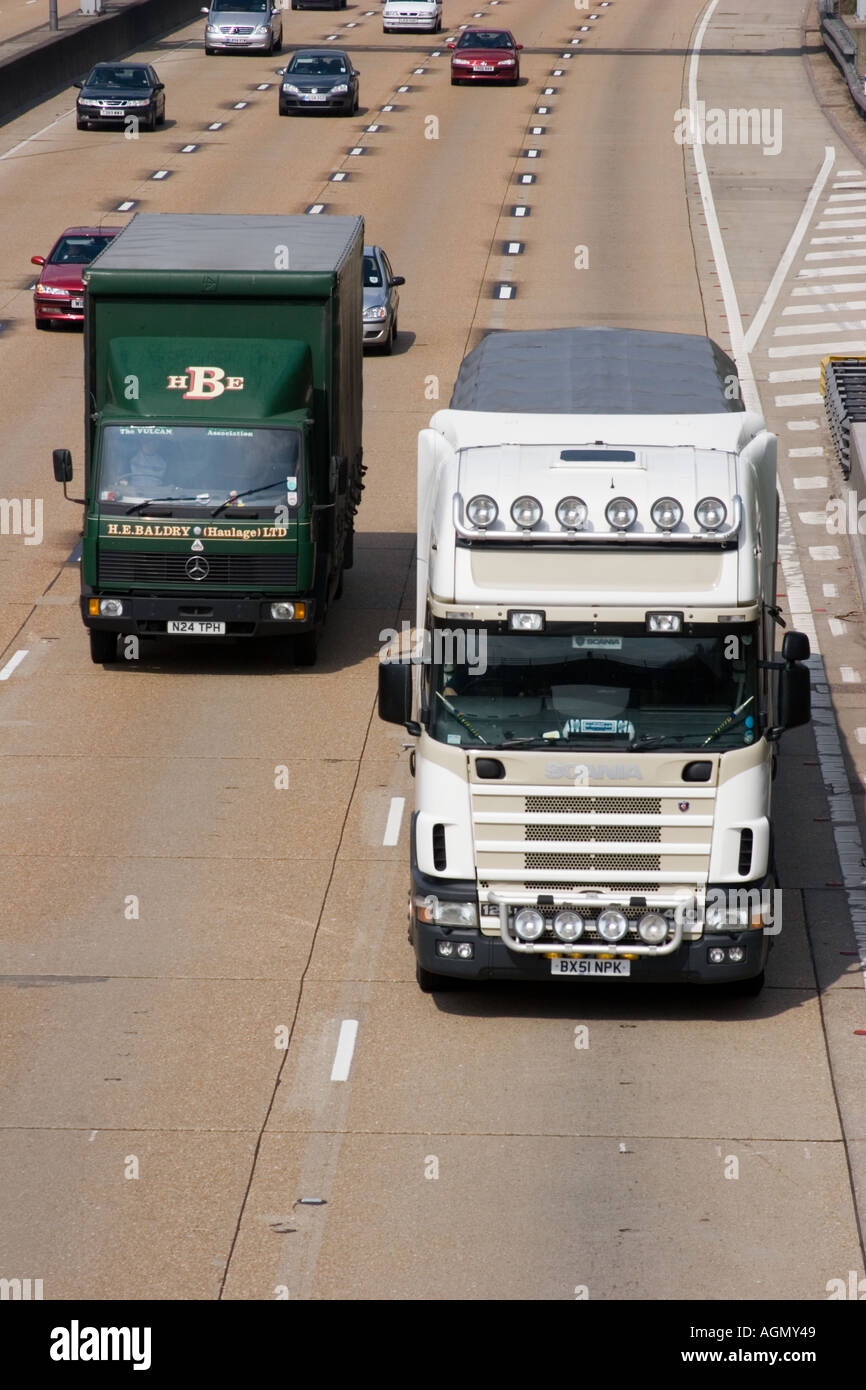 Lorry traffic on the M25 motorway in Surrey England Stock Photo - Alamy