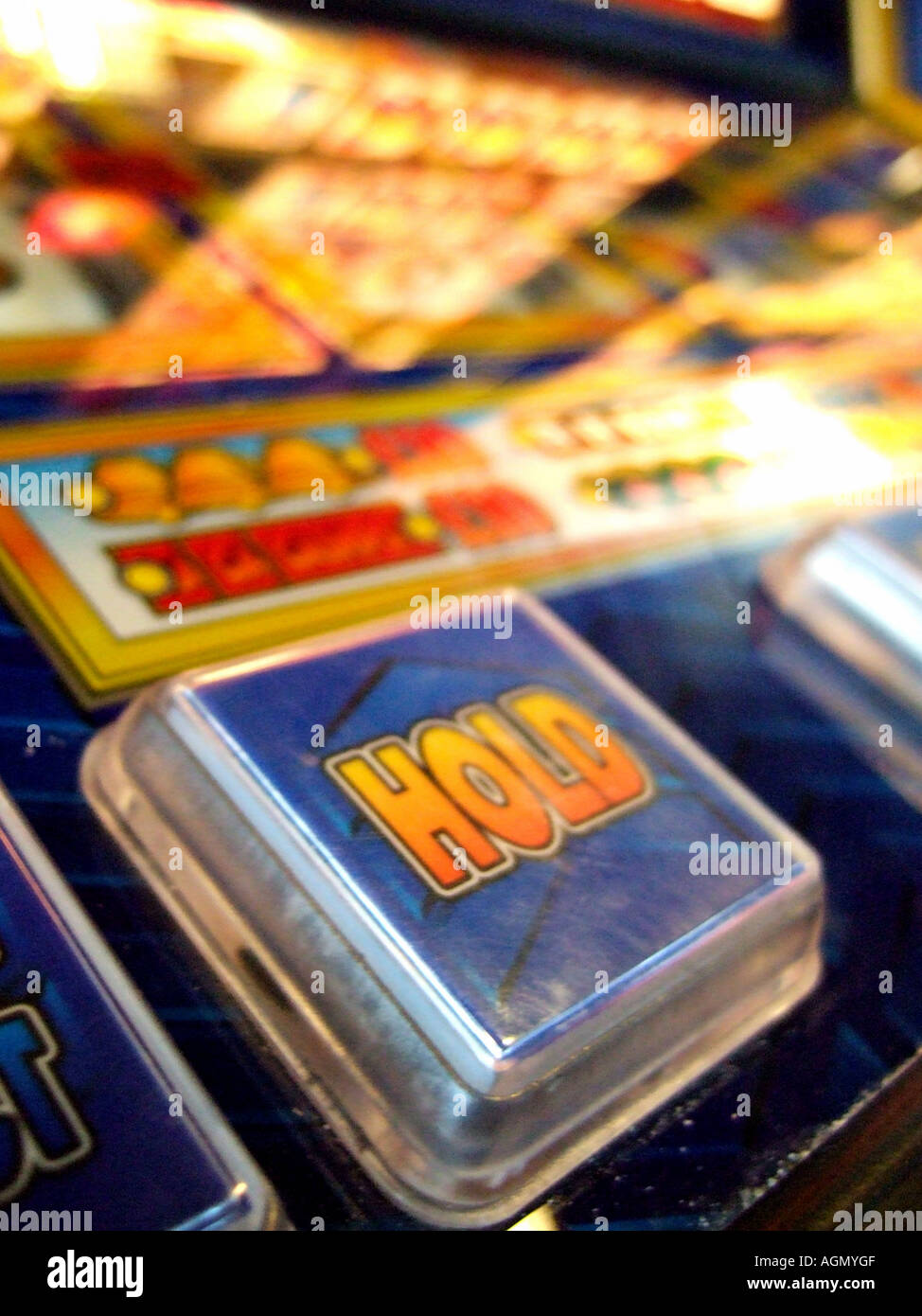 Hold button on fruit machine Stock Photo - Alamy