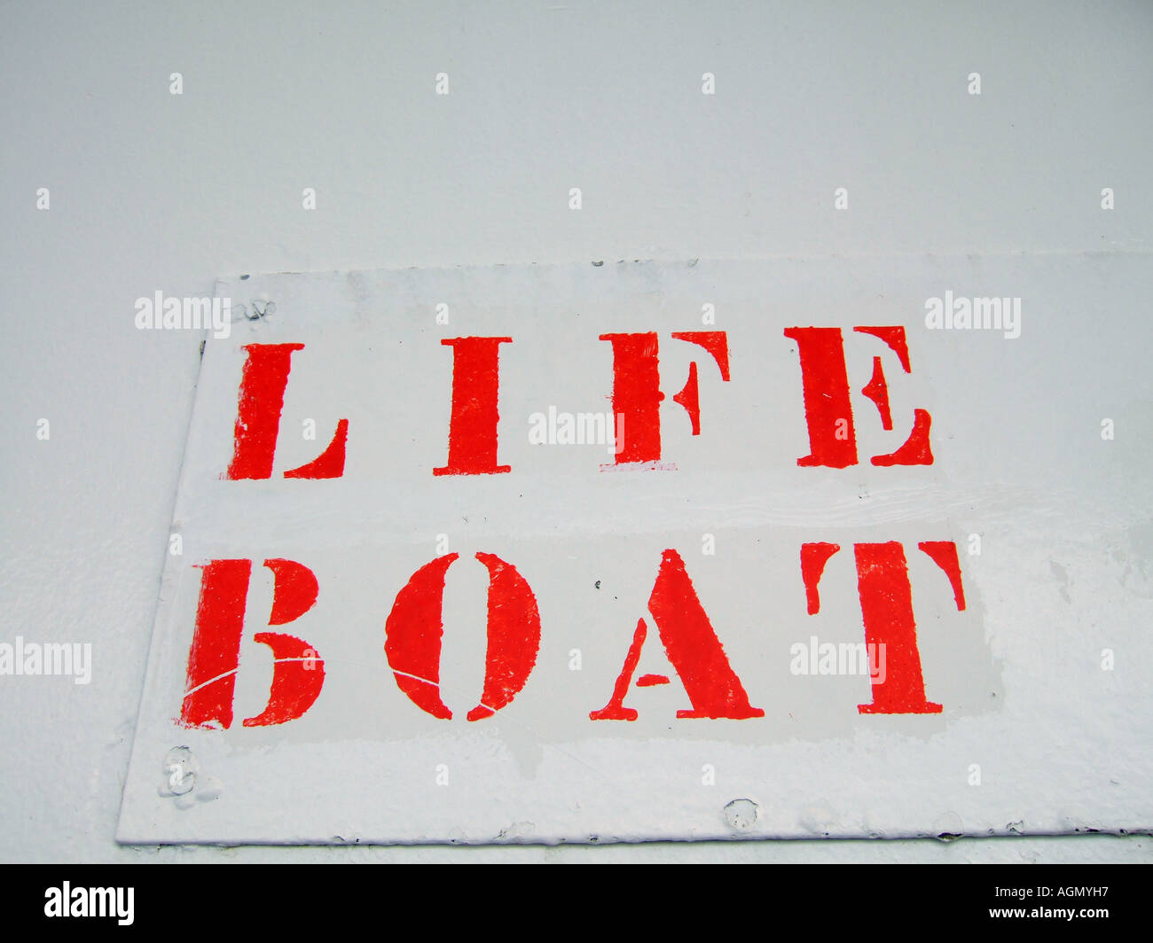 Red Life Boat text stenciled on ships deck Stock Photo - Alamy