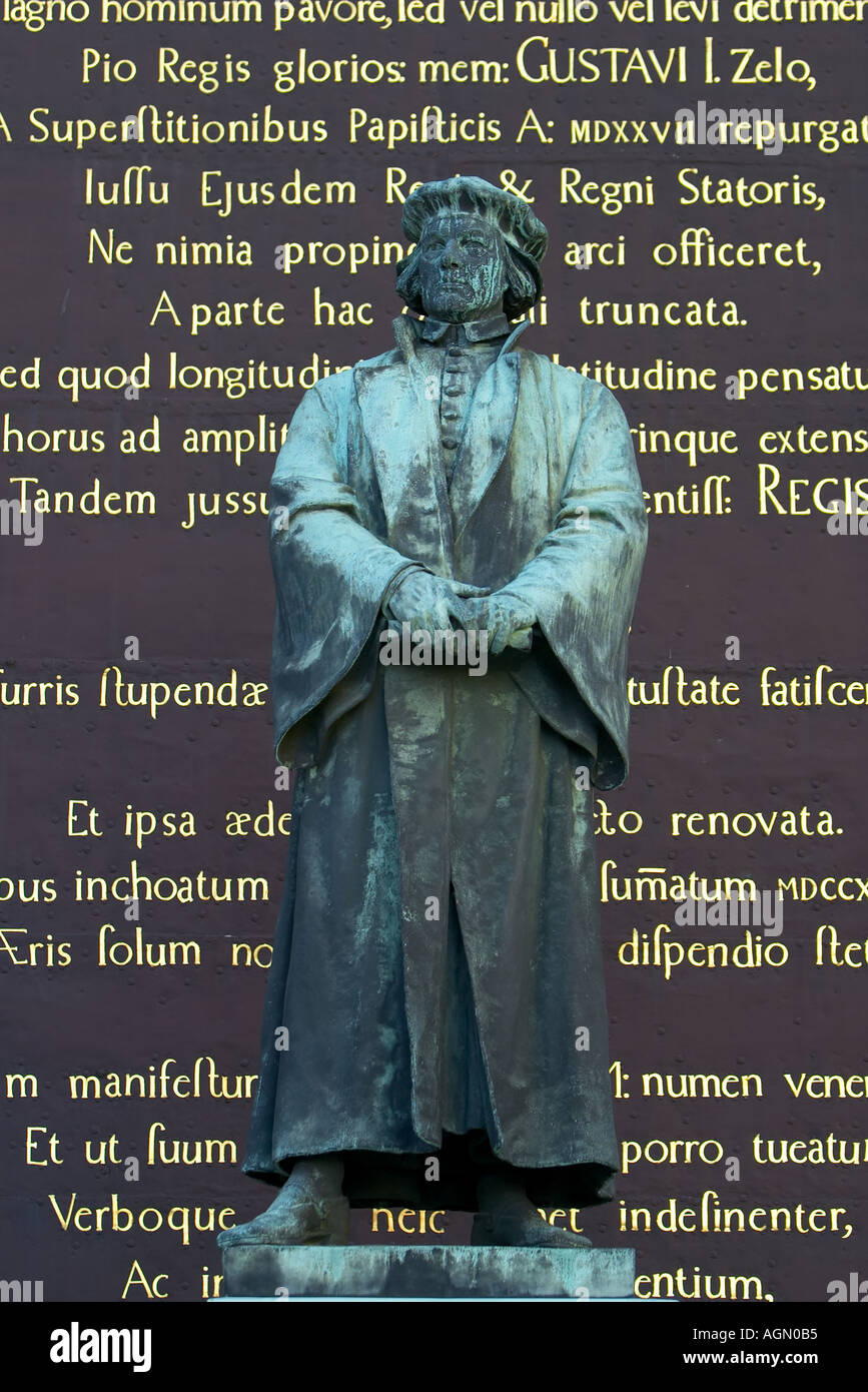 Statue in front of a gold lettered plaque at the Royal palace Stockholm ...