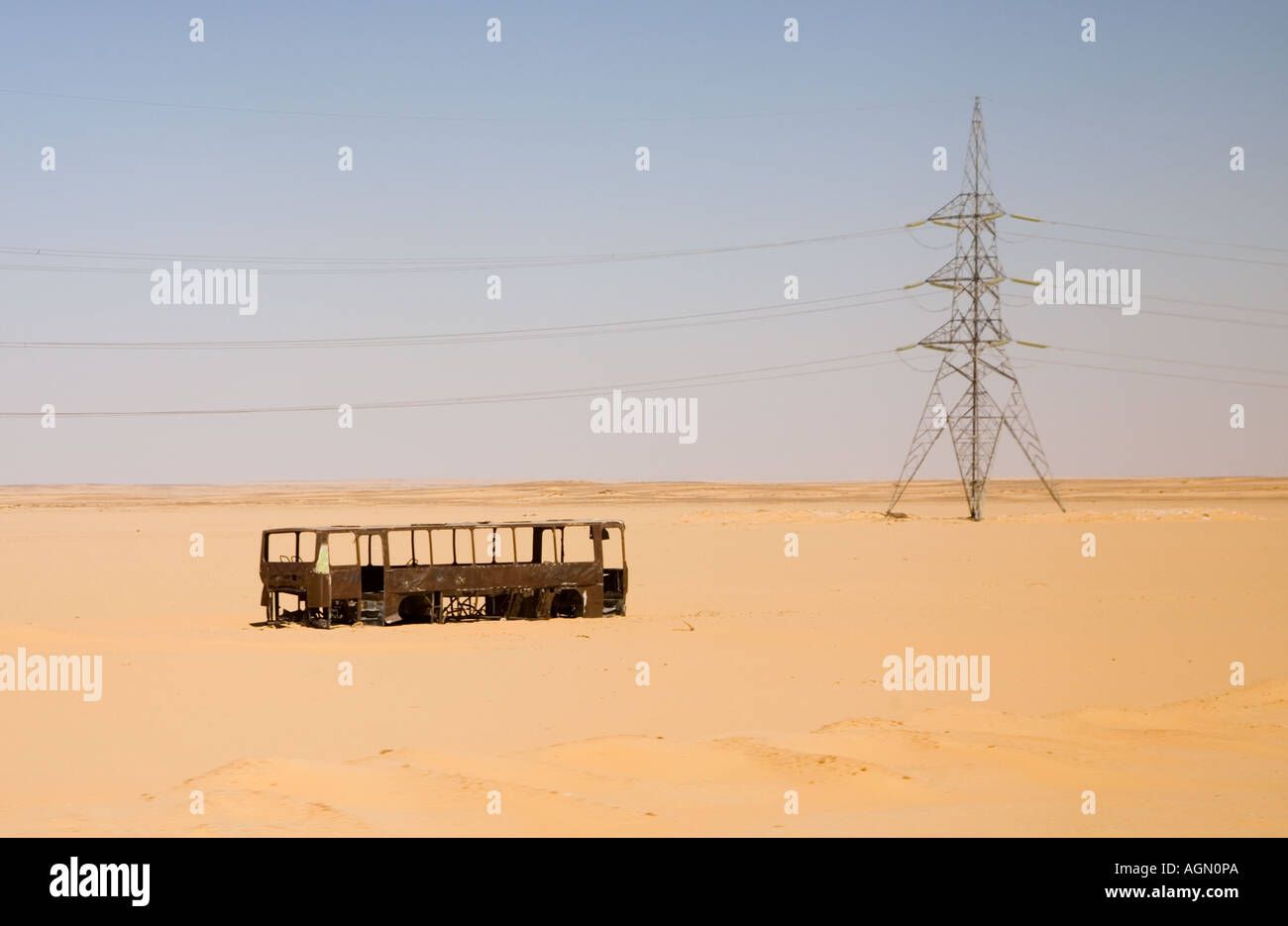 Power Lines and Burnt Out Bus in the Desert Eqypt Stock Photo - Alamy