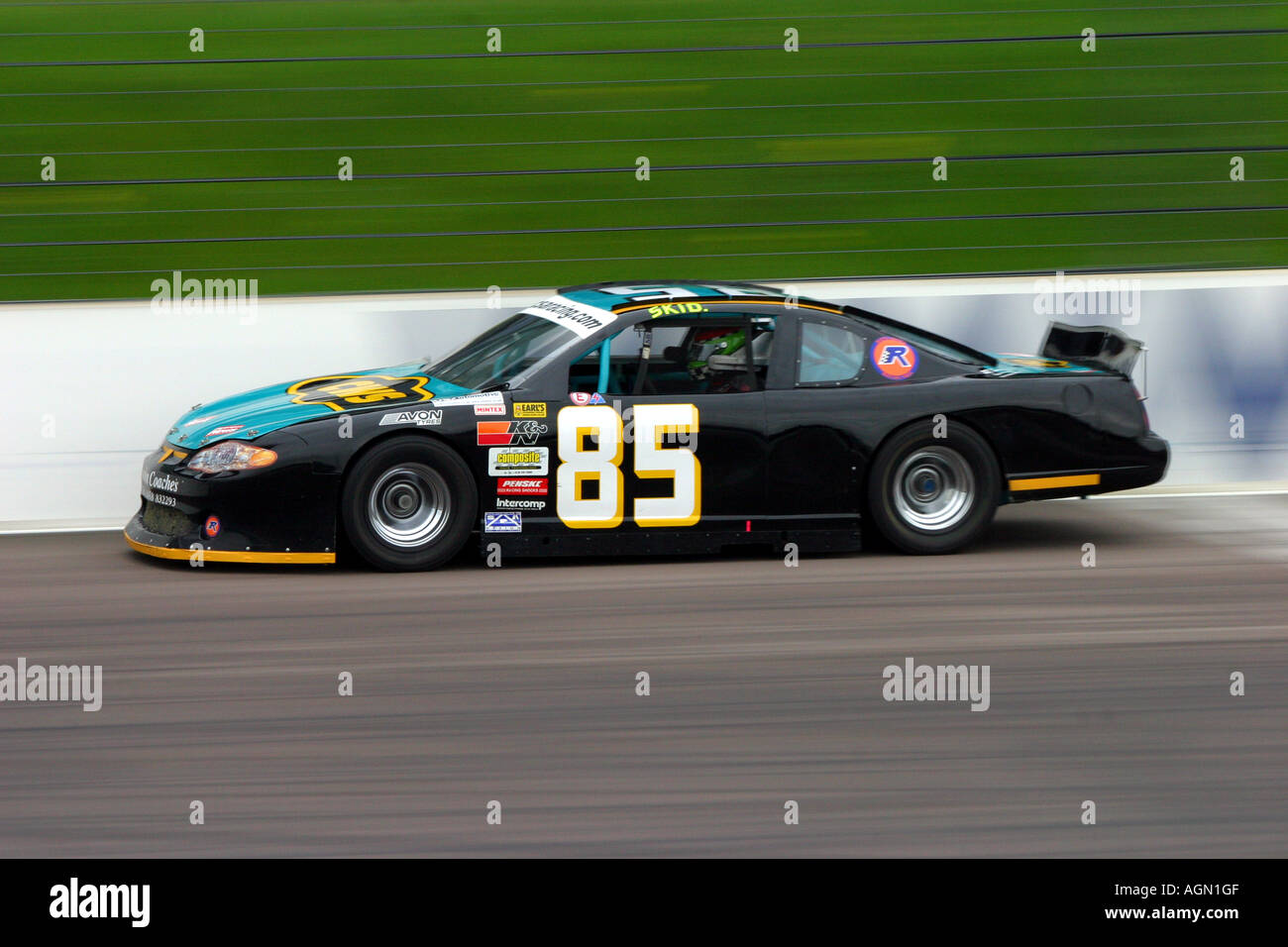 V8 Nascar type stock cars racing on a banked oval circuit Stock Photo ...