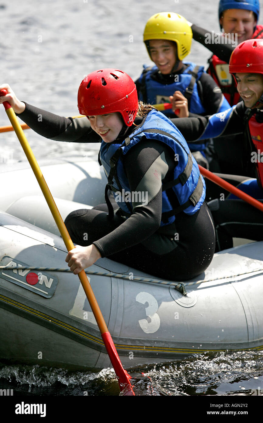 Children and adults enjoy white water rafting on the River Spey near ...