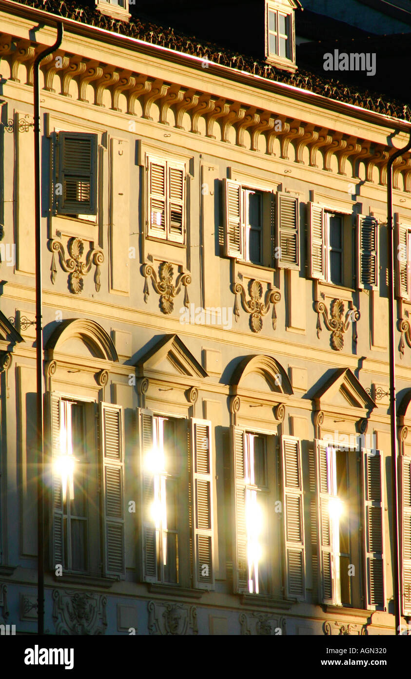Sunset view of shuttered windows frontage of building in Piazza San ...