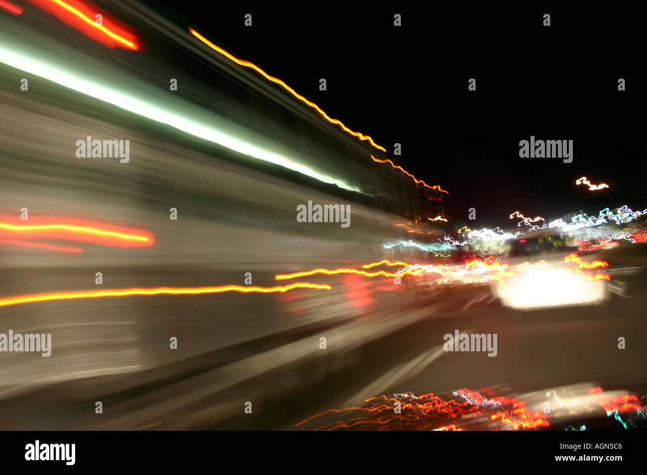 blurred bus on street at night Stock Photo - Alamy