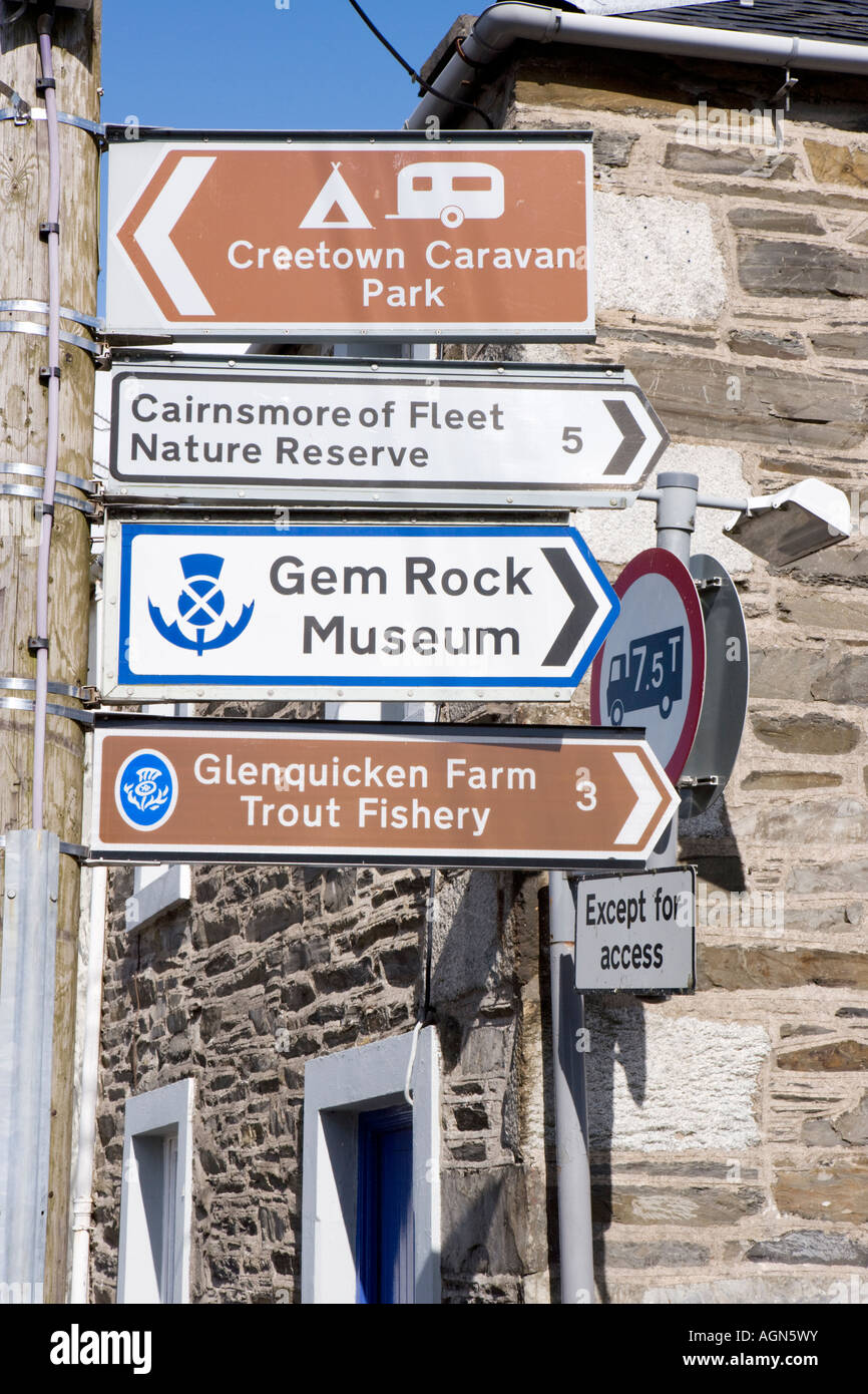 Road traffic signs on lap post pointing tourists to local visitor ...