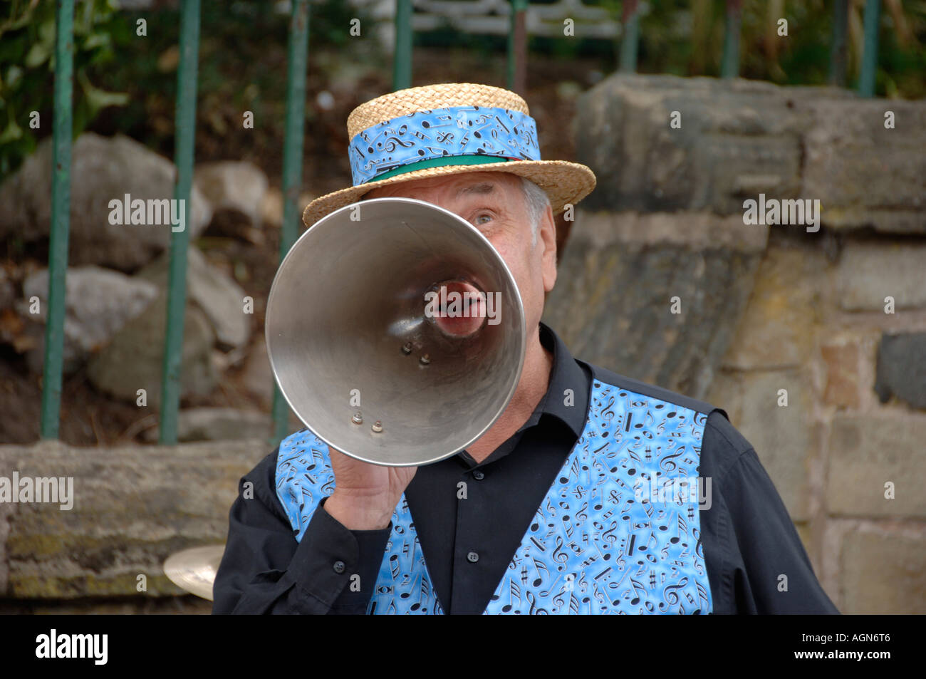 Jazz singer making an announcement on an old speaker horn at the Crich ...
