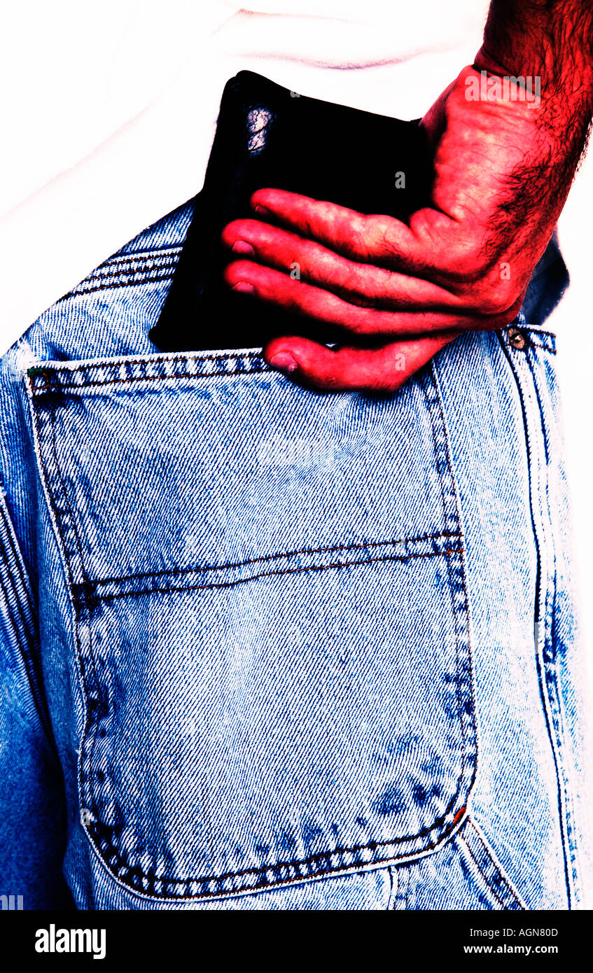 Man putting wallet in jeans pocket Stock Photo - Alamy