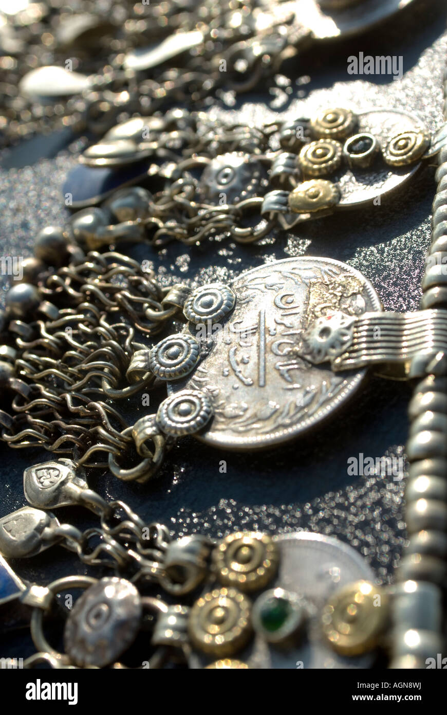 Hand made silver jewelry on a black background Stock Photo - Alamy